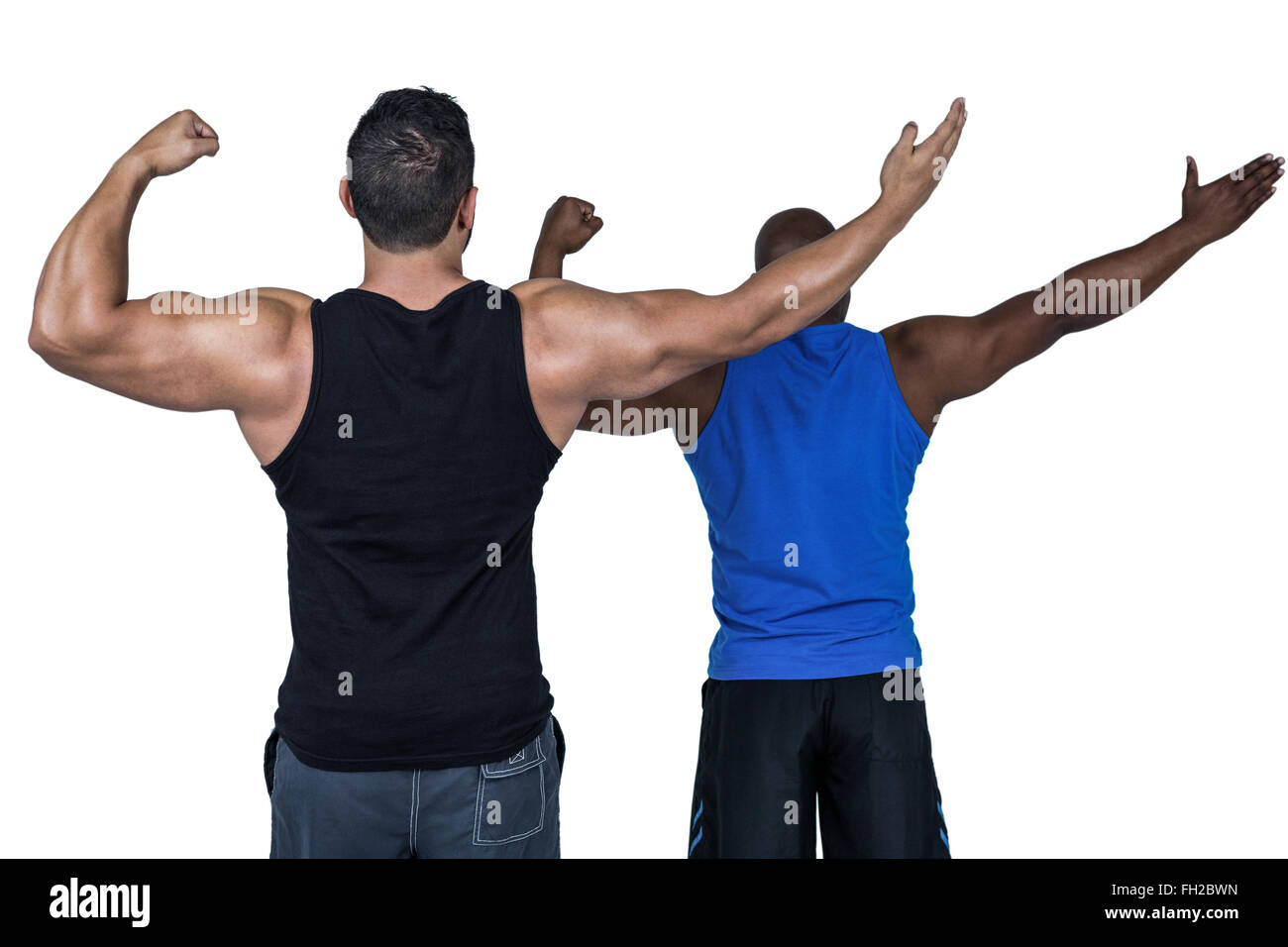 Strong friends posing with arms out Stock Photo - Alamy