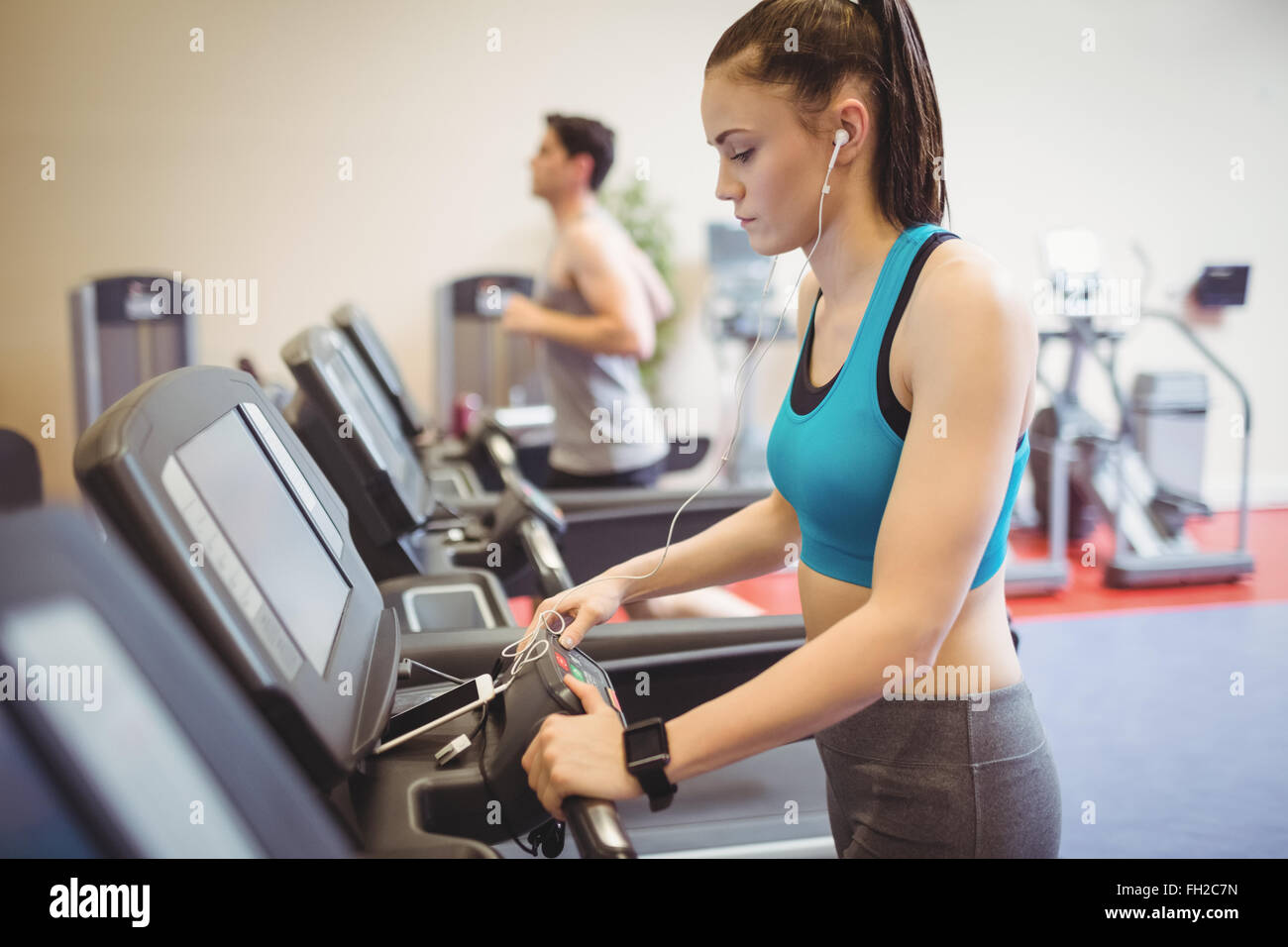 Fit woman on treadmill headphones hi-res stock photography and images ...