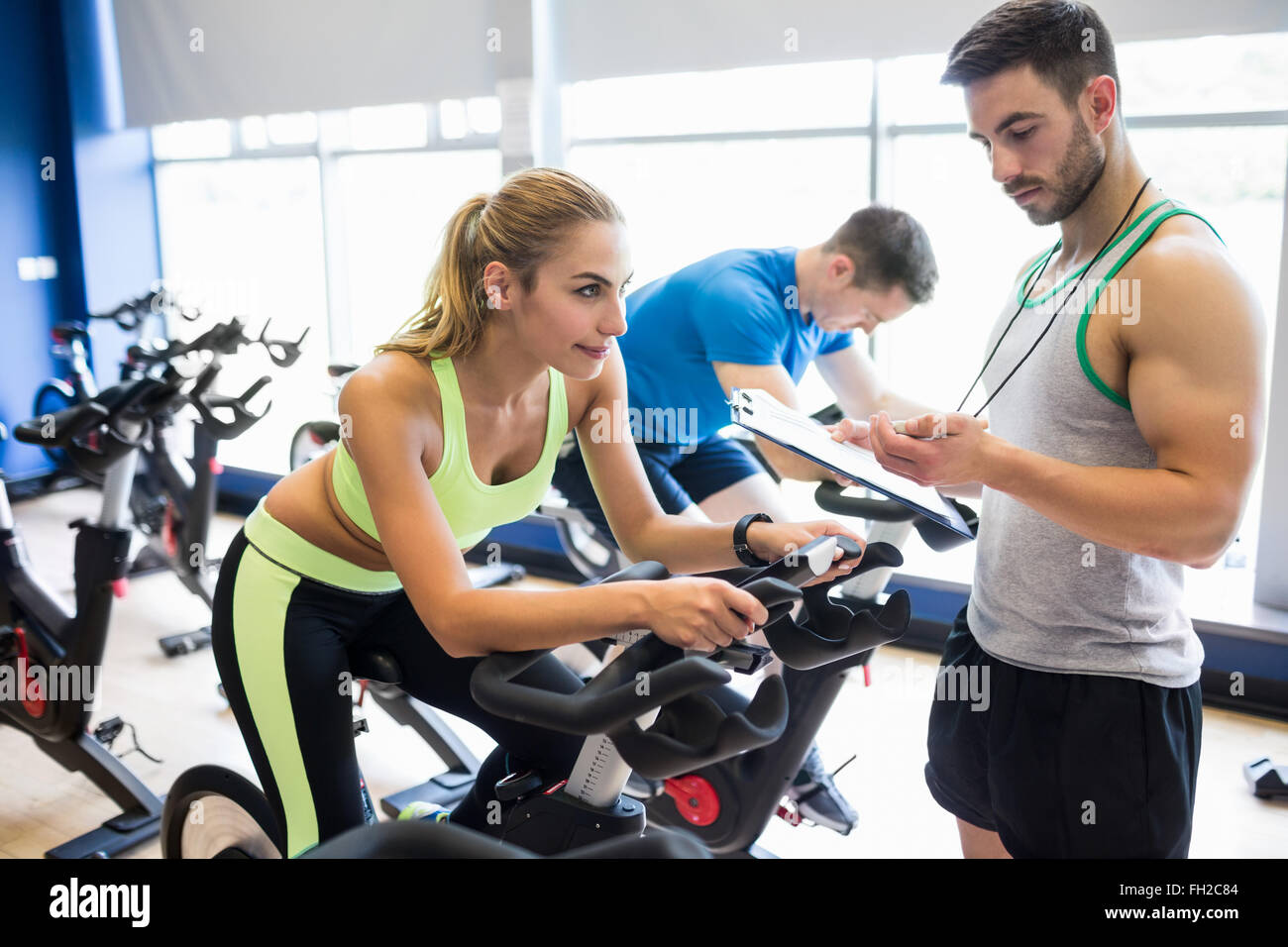 Fit people in a spin class Stock Photo - Alamy