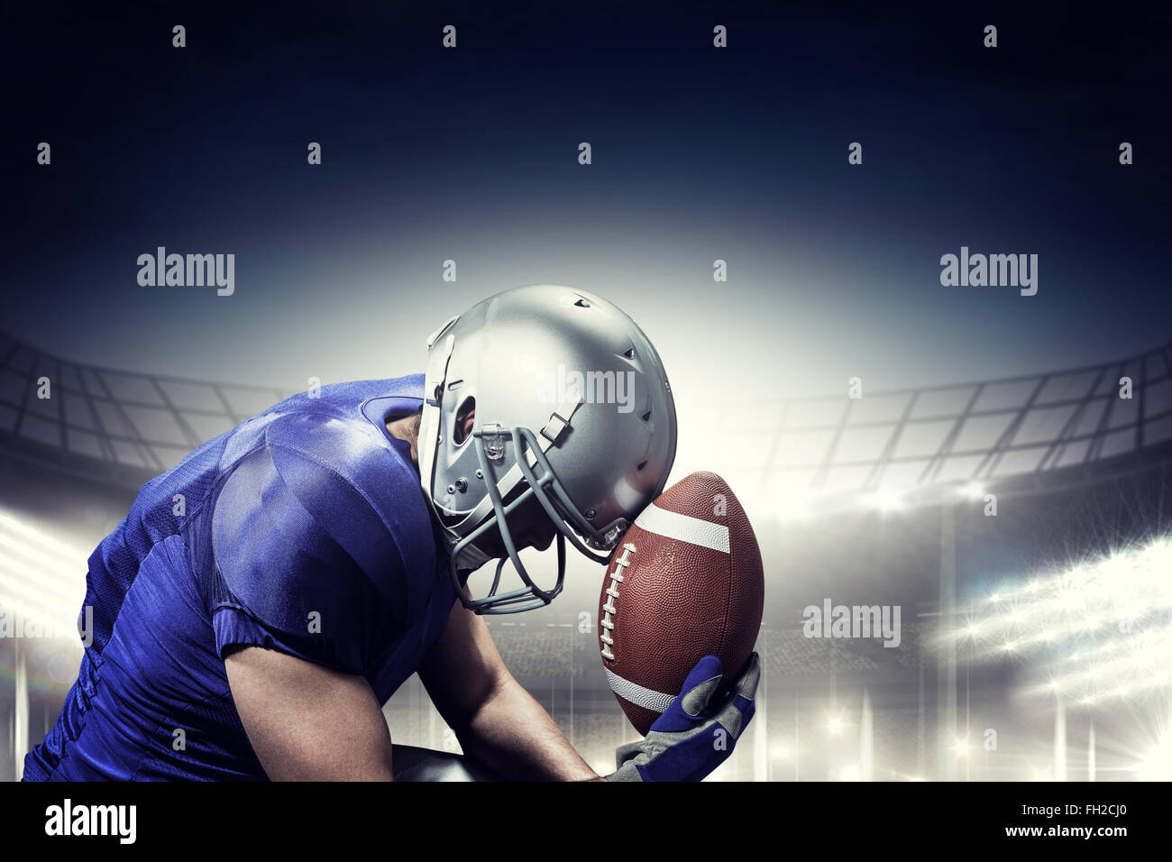 Composite image of upset american football player with ball Stock Photo ...