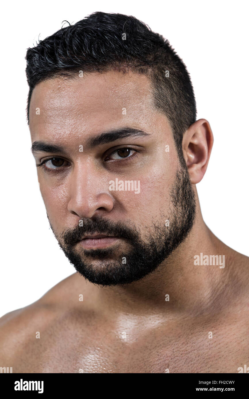 Muscular man frowning at camera Stock Photo - Alamy