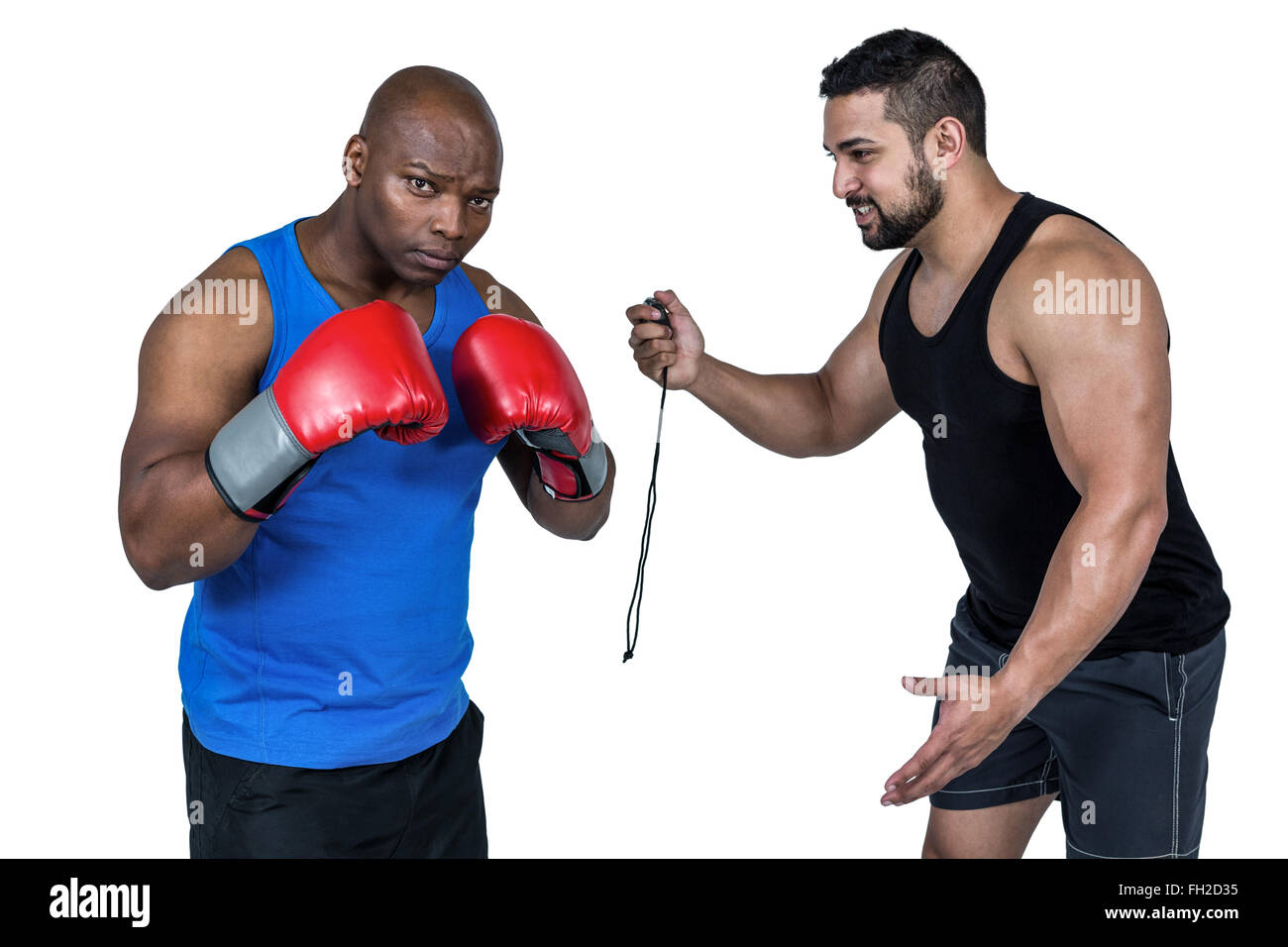 Strong friends using kettlebells together Stock Photo - Alamy