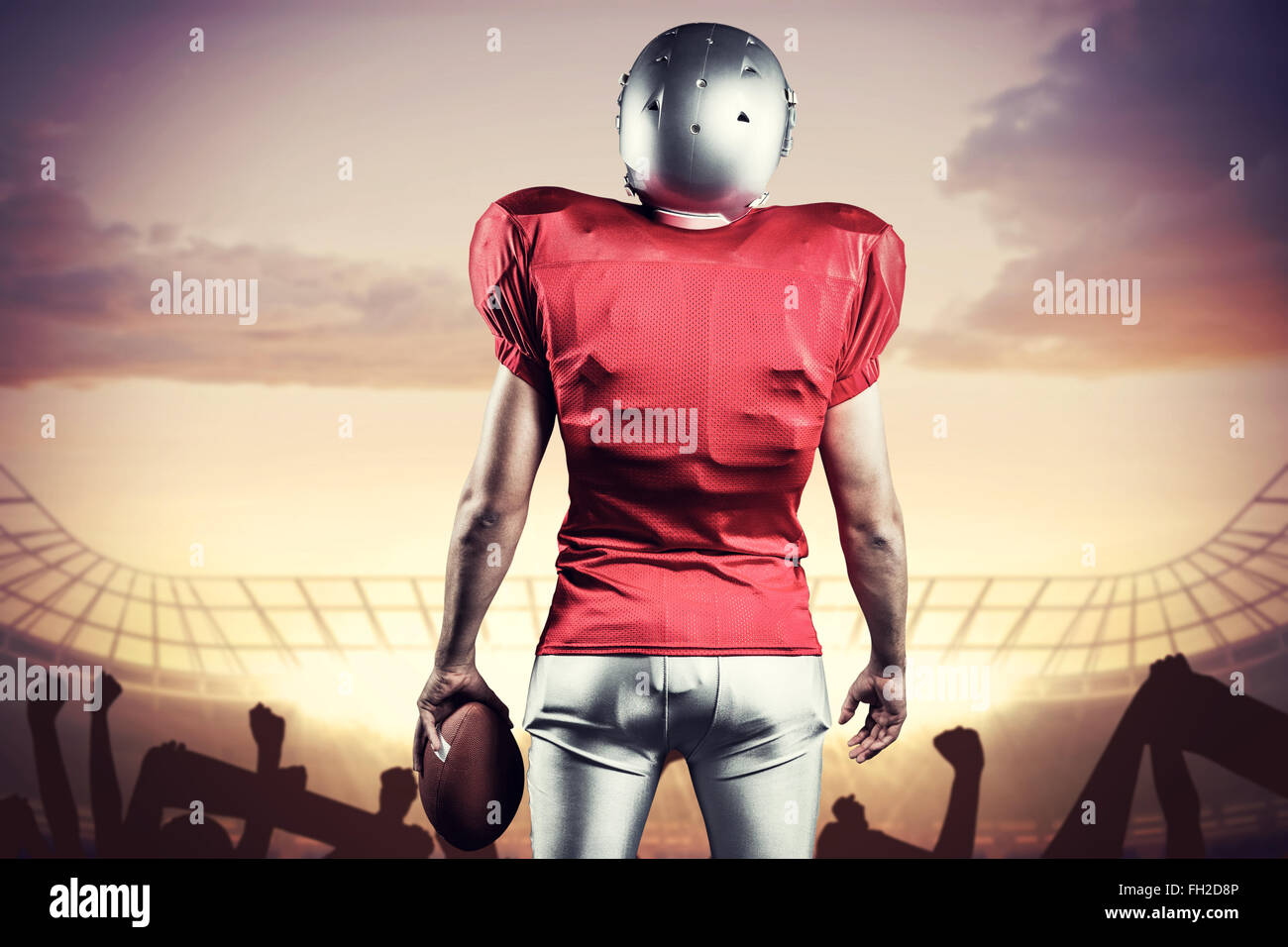 Composite image of rear view of american football player with ball ...