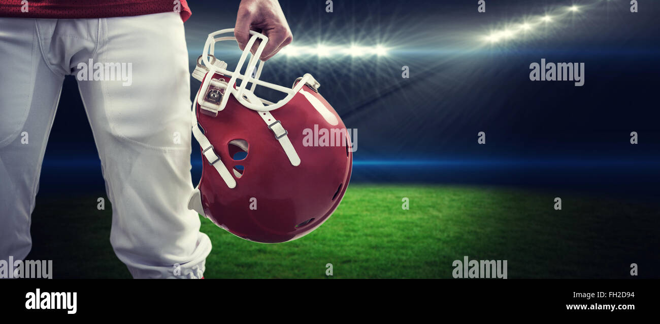 Composite image of an american football player taking his helmet on ...