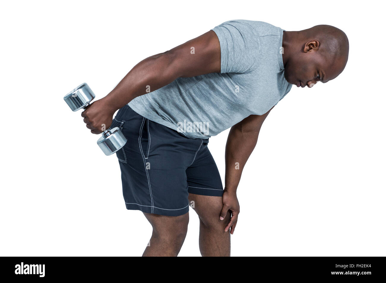 Fit man exercising with dumbbell Stock Photo - Alamy