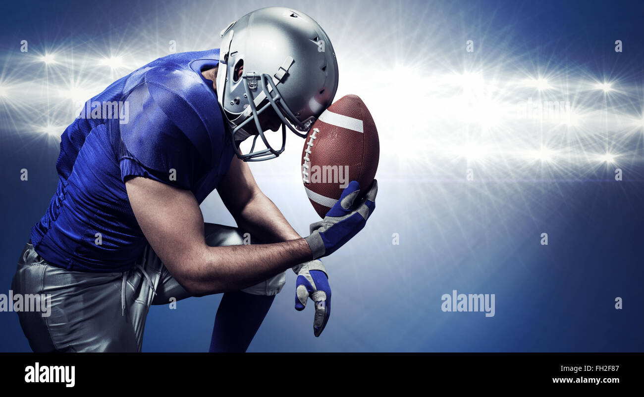 Composite image of upset american football player with ball Stock Photo ...