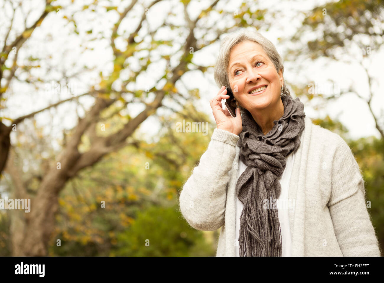 Senior woman in the park Stock Photo - Alamy