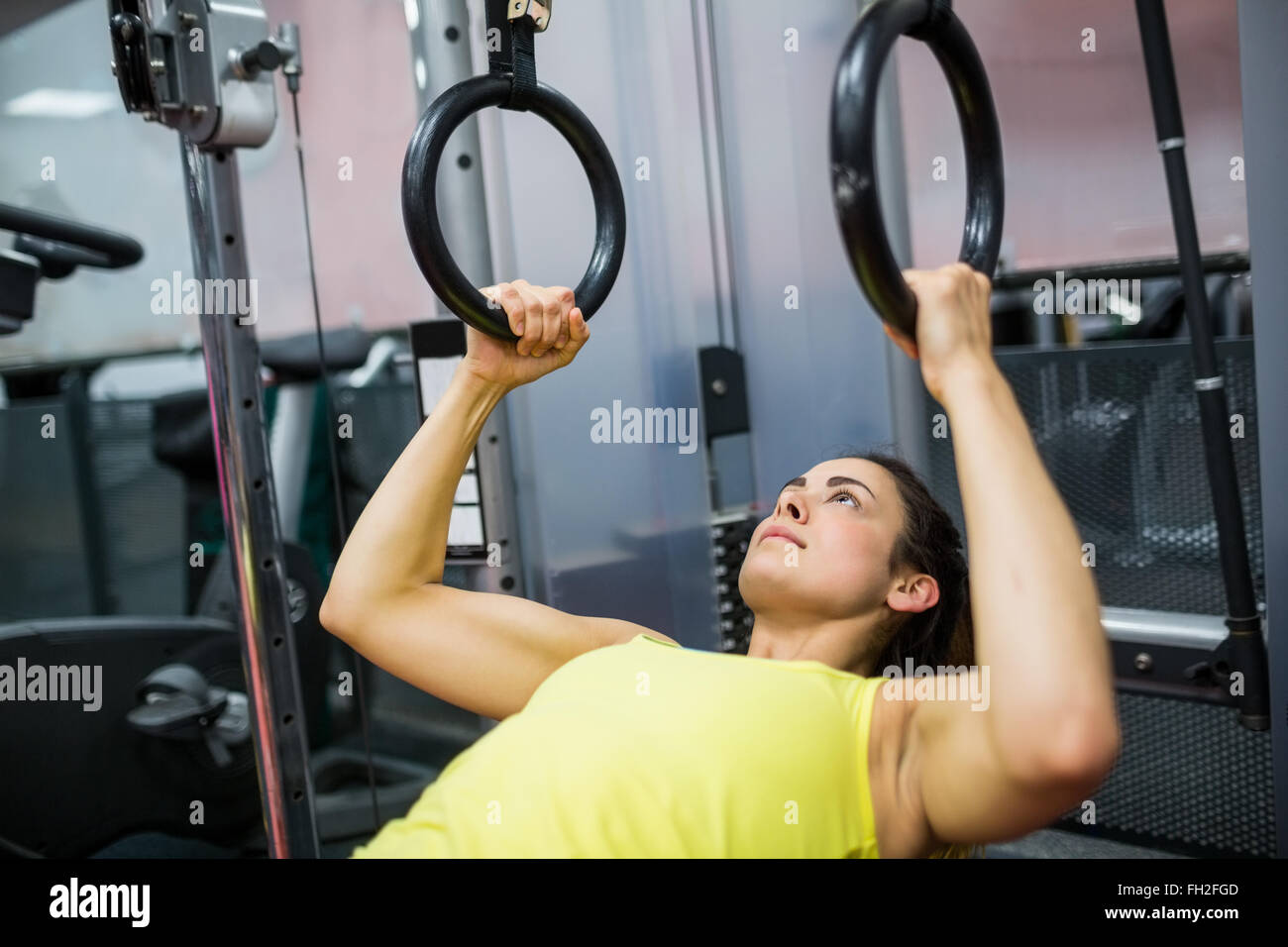 Smiling woman exercising her arms Stock Photo - Alamy