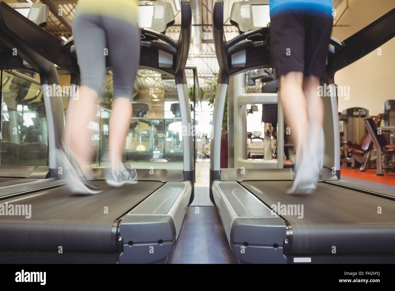 Fit people using the treadmill Stock Photo - Alamy