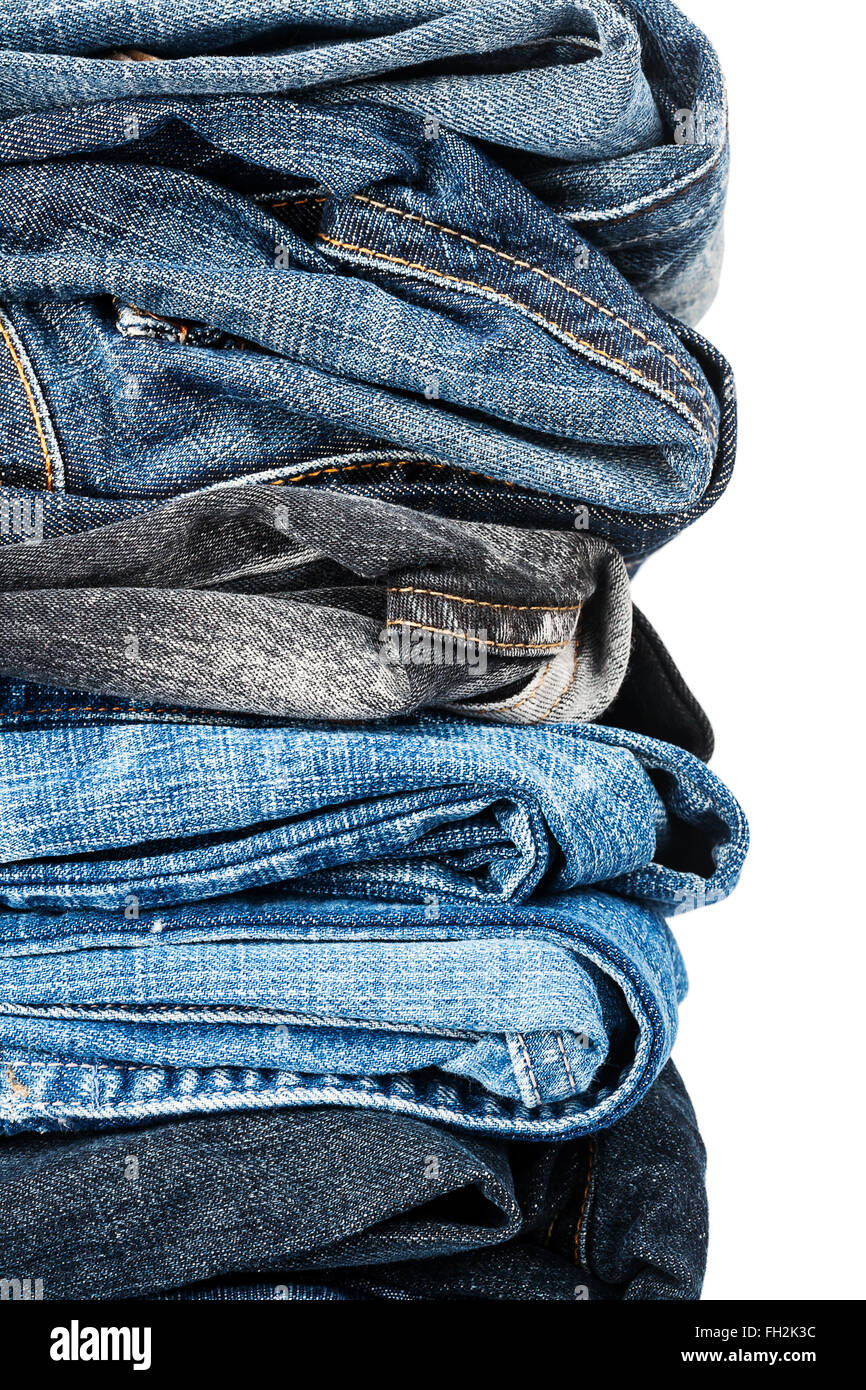 Stack of jeans isolated on white background Stock Photo - Alamy