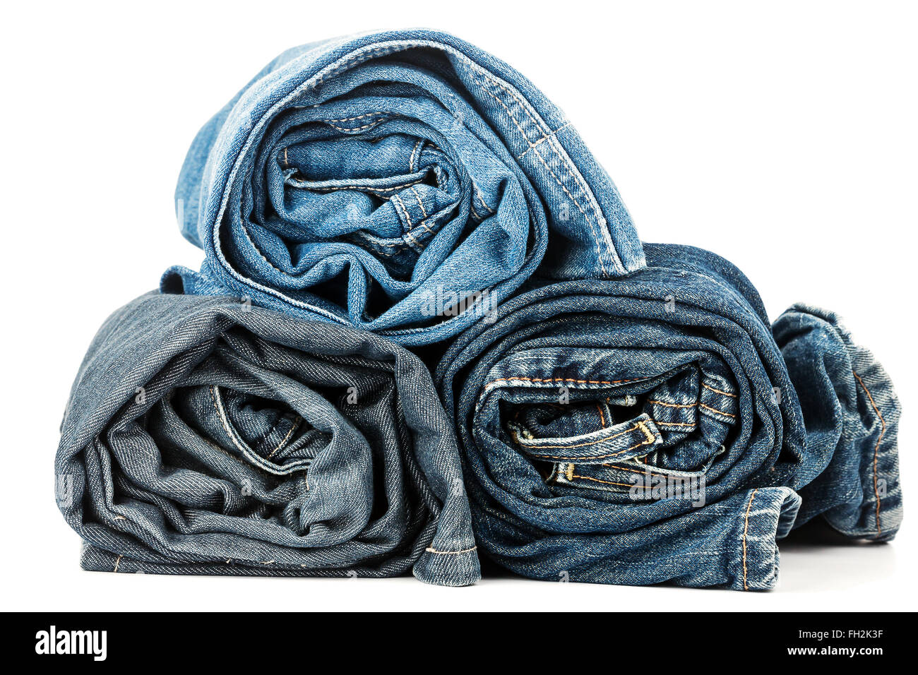 Stack of jeans isolated on white background Stock Photo - Alamy