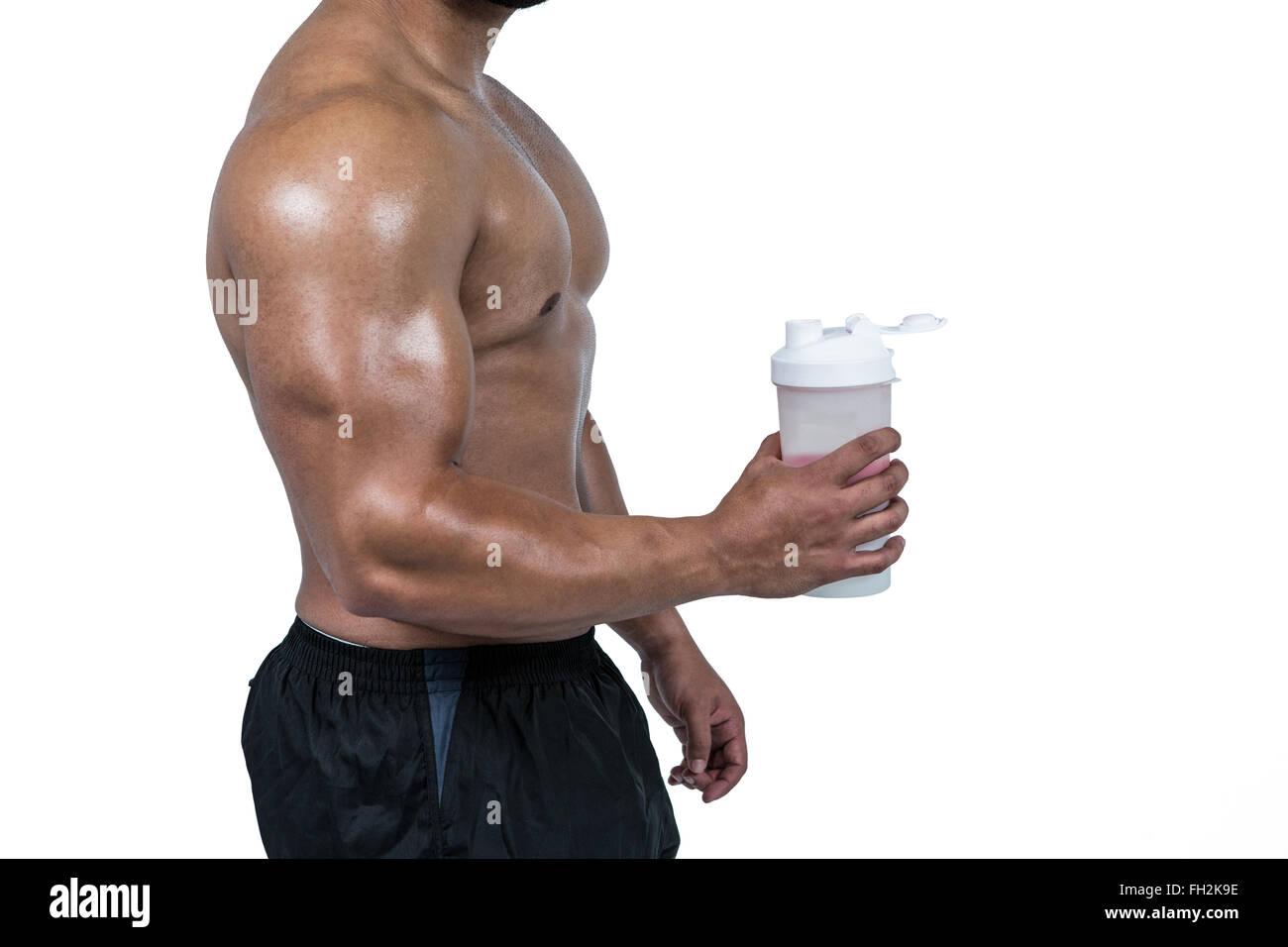 Muscular man with protein powder Stock Photo - Alamy