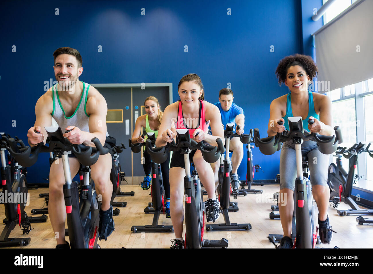Fit people in a spin class Stock Photo - Alamy