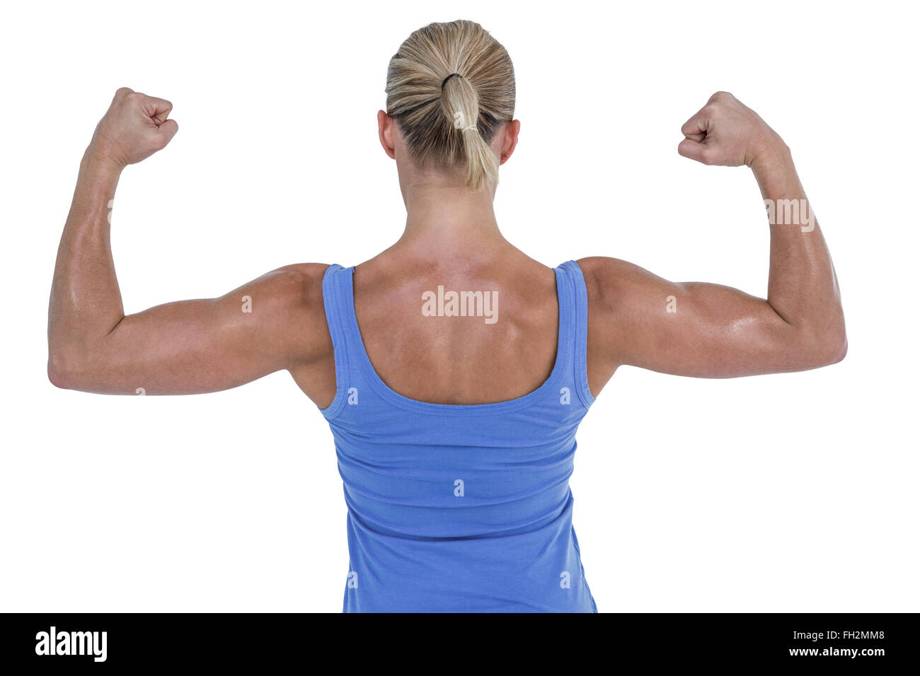 Rear view of woman flexing muscles Stock Photo - Alamy