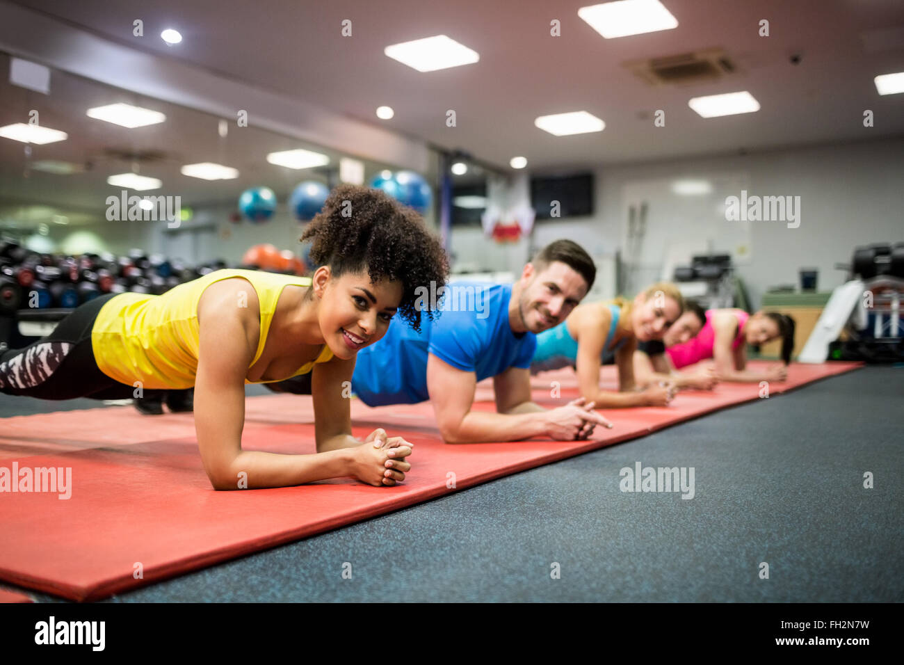 Fit people working out in fitness class Stock Photo - Alamy