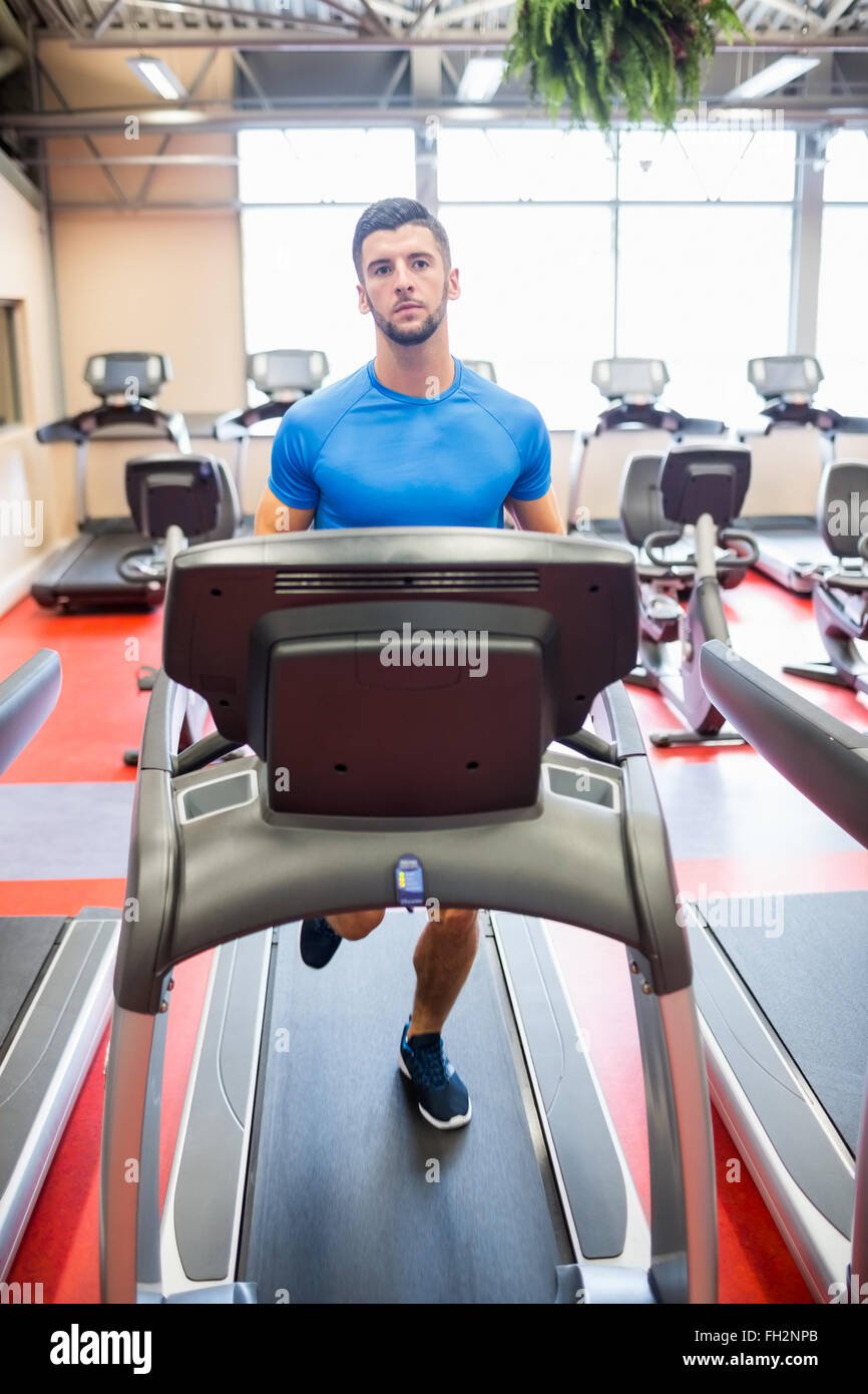 Man running on a treadmill Stock Photo - Alamy