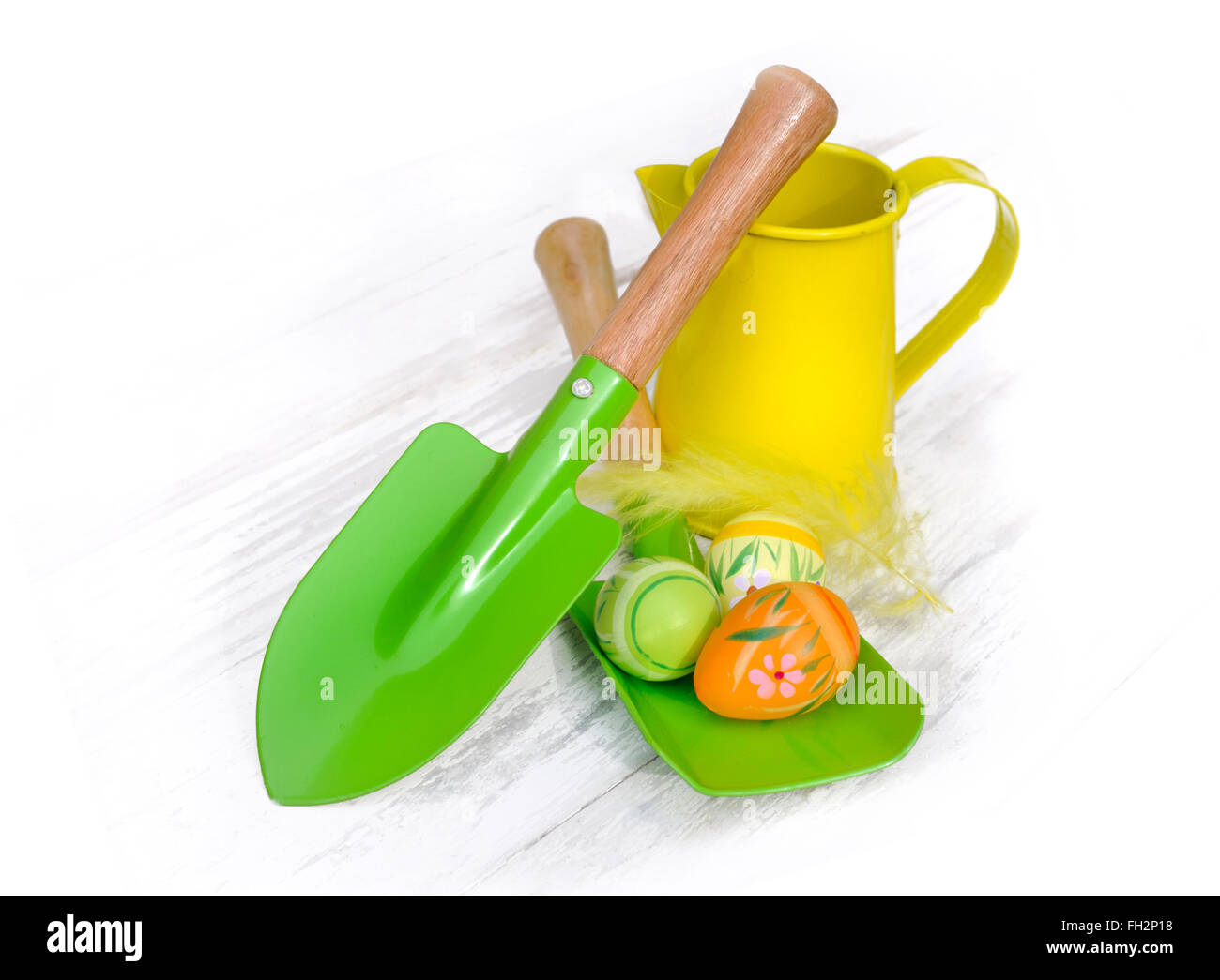 little gardening tools and easter eggs on white background Stock Photo ...