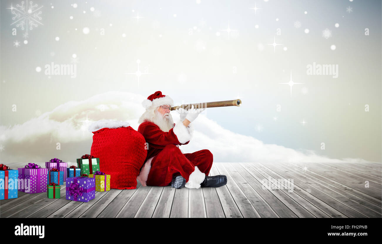 Composite image of santa looking through telescope Stock Photo - Alamy