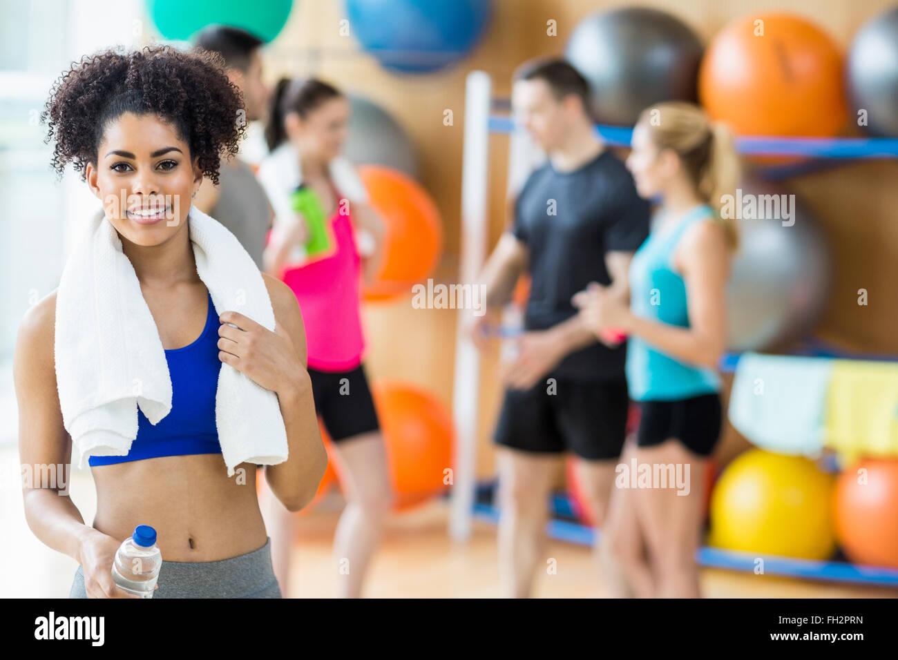 Fit woman smiling at camera Stock Photo - Alamy