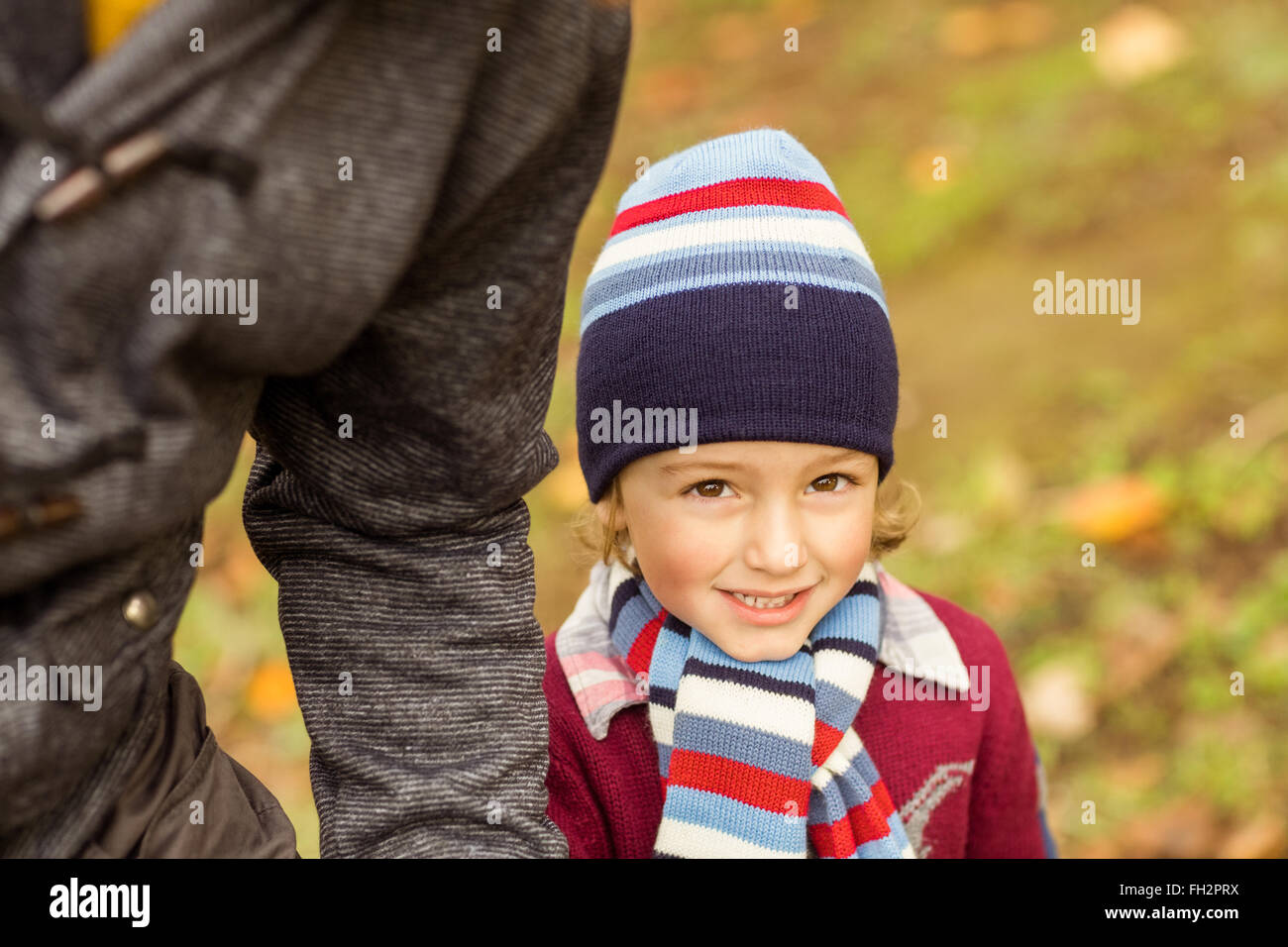 Portrait of little boy walking with his father Stock Photo - Alamy