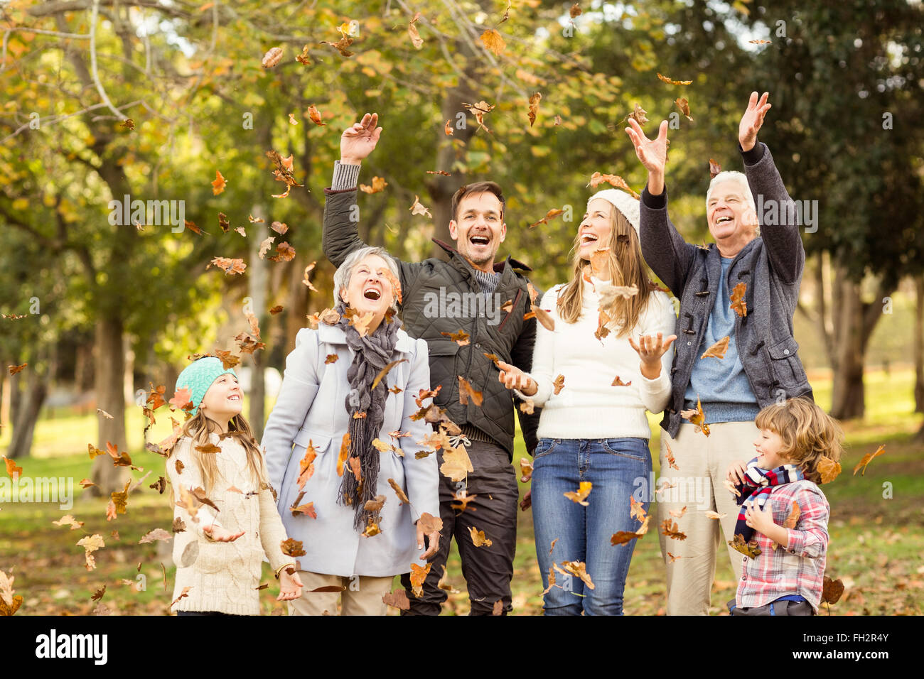 Boy girl throwing autumn leaves hi-res stock photography and images - Alamy
