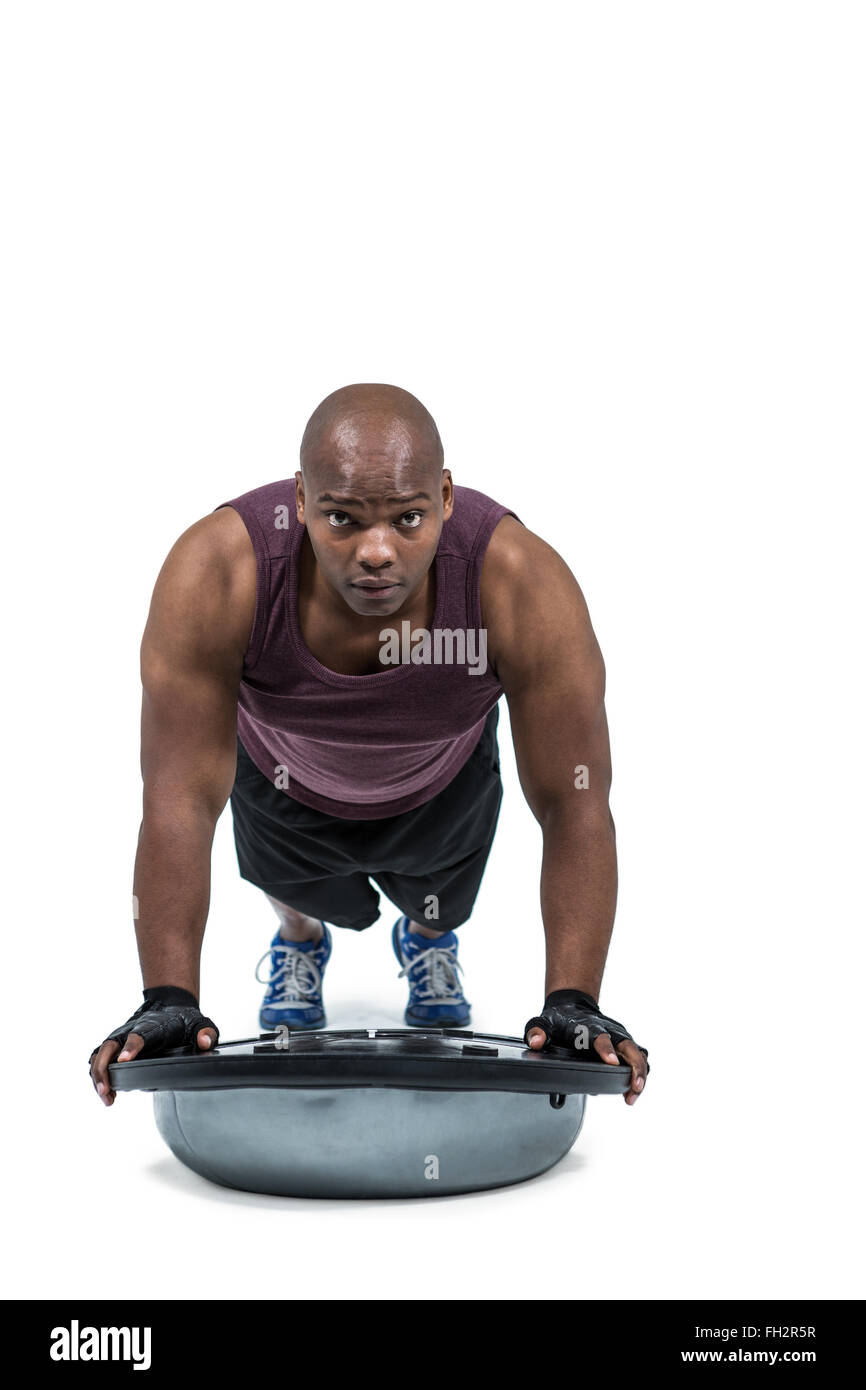 Fit man exercising with bosu ball Stock Photo - Alamy