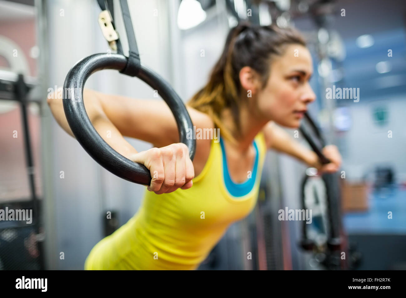 Smiling woman exercising her arms Stock Photo - Alamy