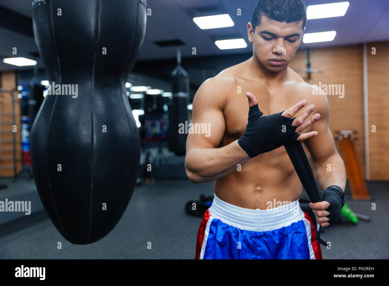 Boxer getting ready for fight in gym Stock Photo - Alamy
