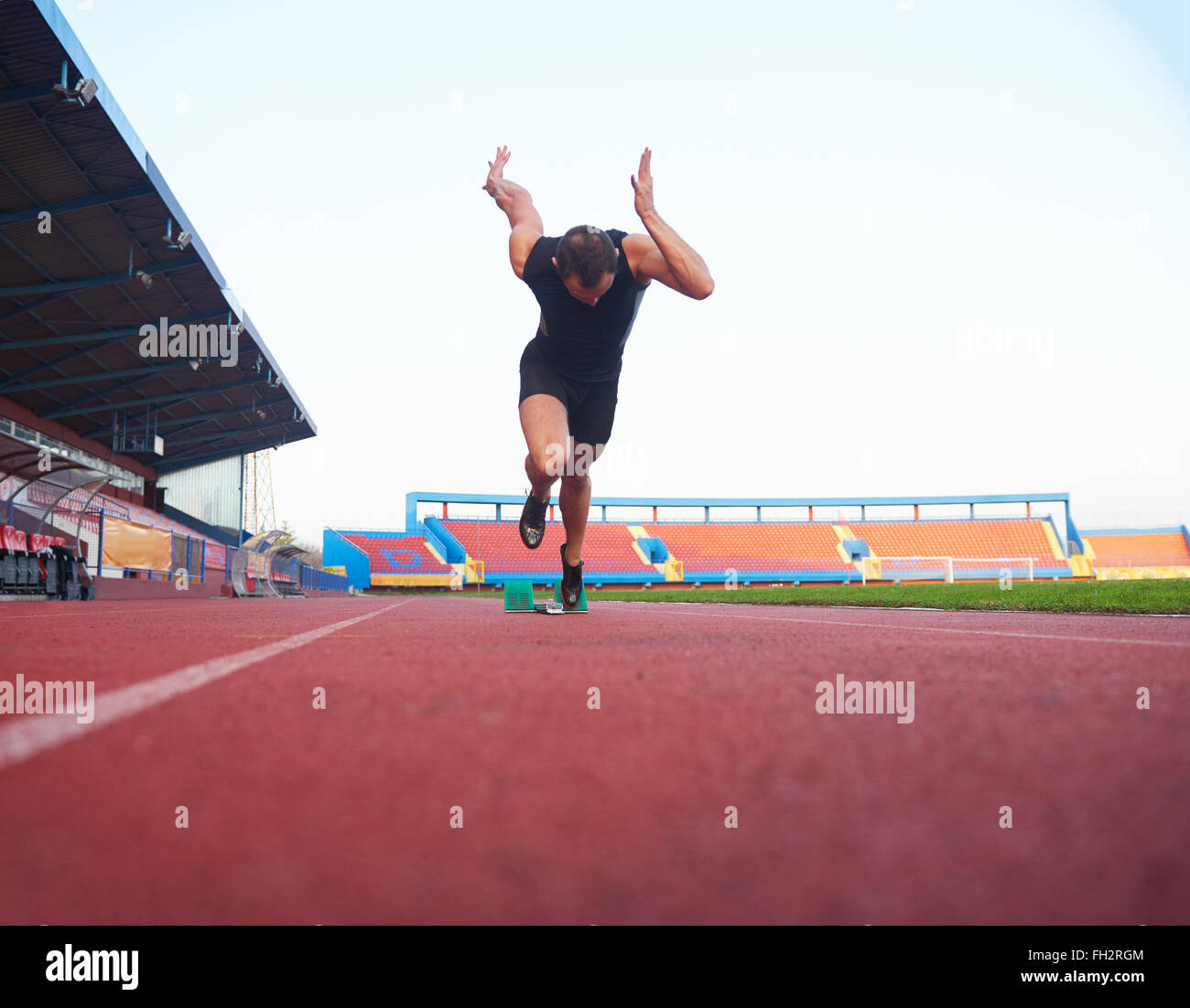 Female sprinter leaving starting blocks hi-res stock photography and ...