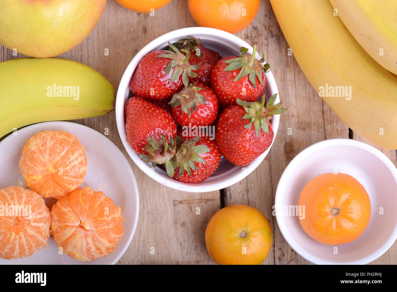 Fresh colorful fruits composition mandarin, strawberry, peach, bananas ...