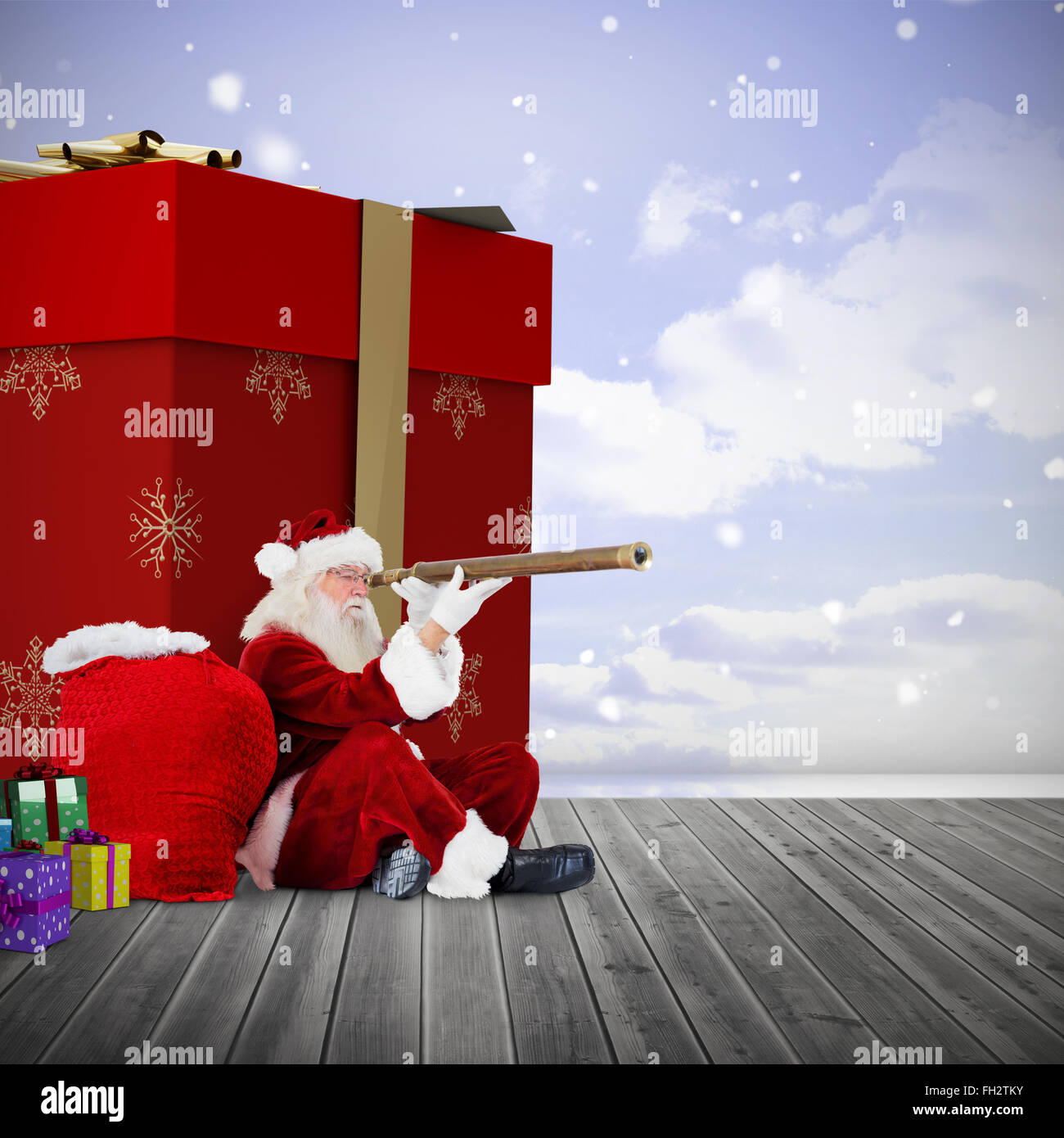 Composite image of santa looking through a telescope Stock Photo - Alamy