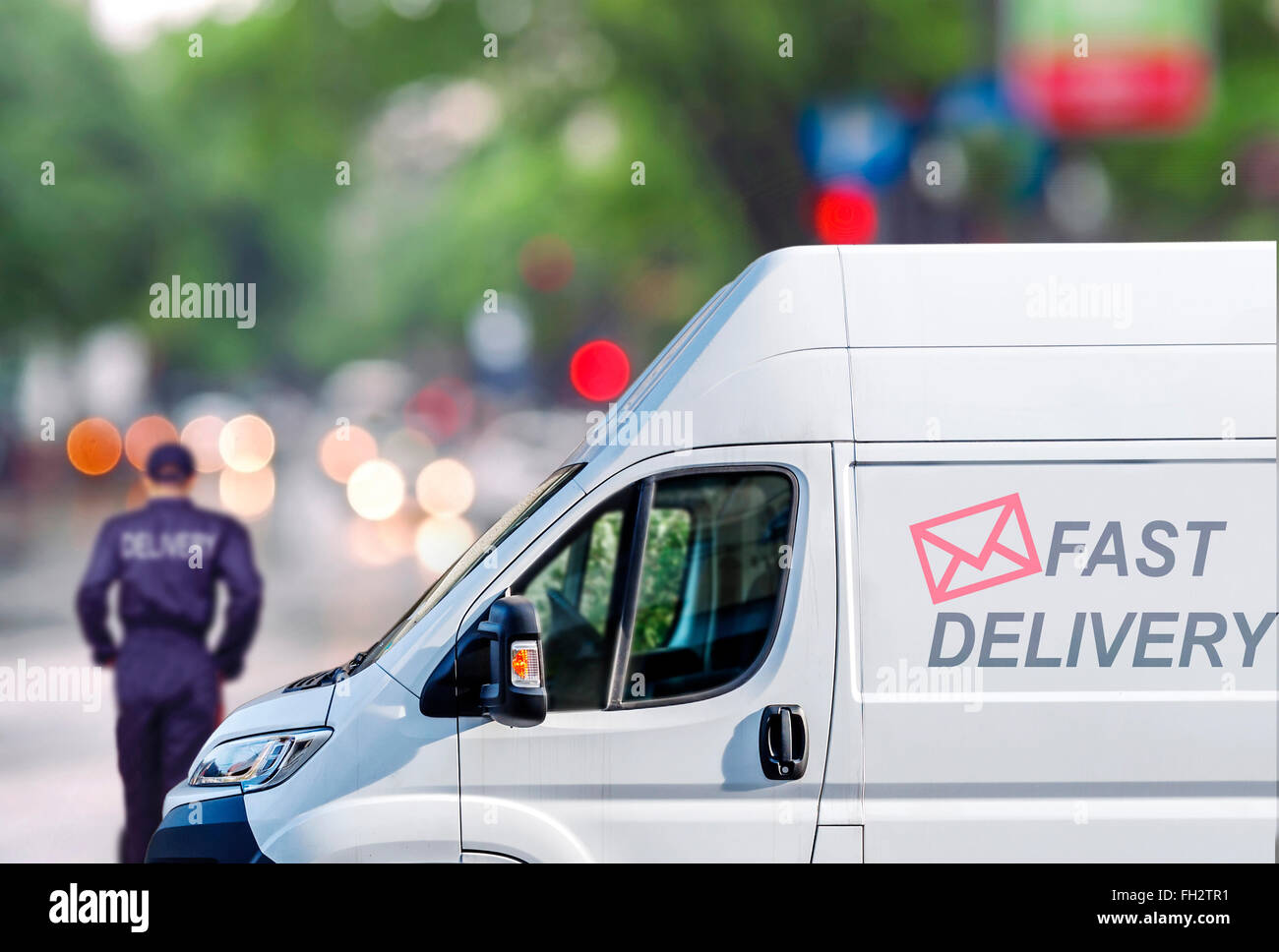 Fast delivery Van on city street Stock Photo - Alamy