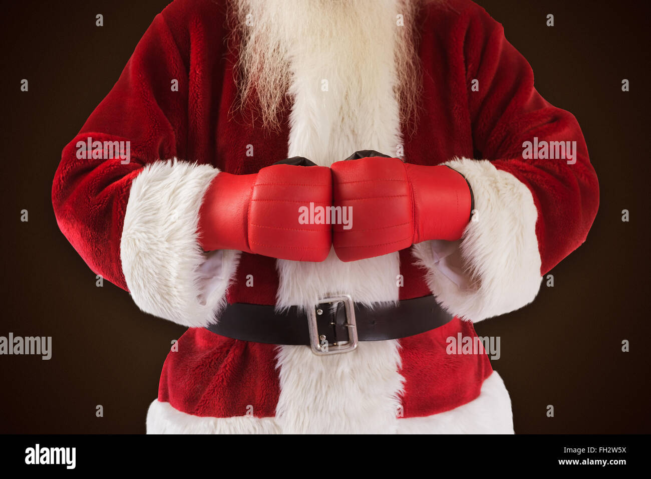 Composite image of santa claus wears boxing gloves Stock Photo - Alamy