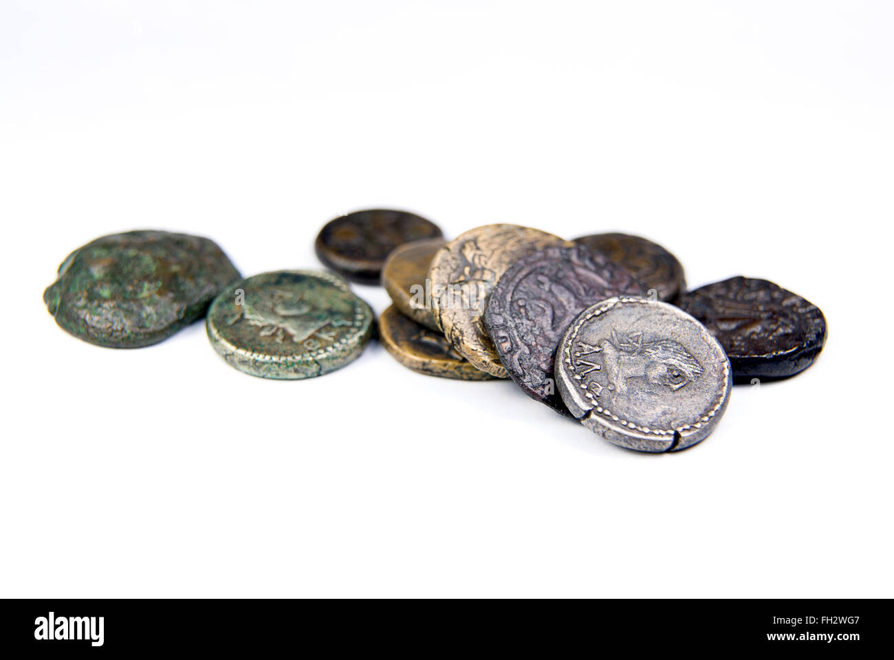 A lot of old coins with portraits of kings on a white background Stock ...