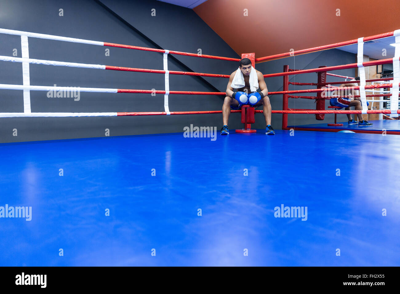 Male boxer with towel resting in the corner of the boxing ring Stock ...