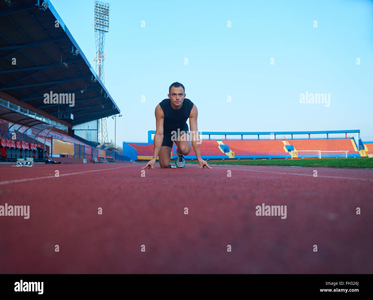 Athletic man start Stock Photo - Alamy