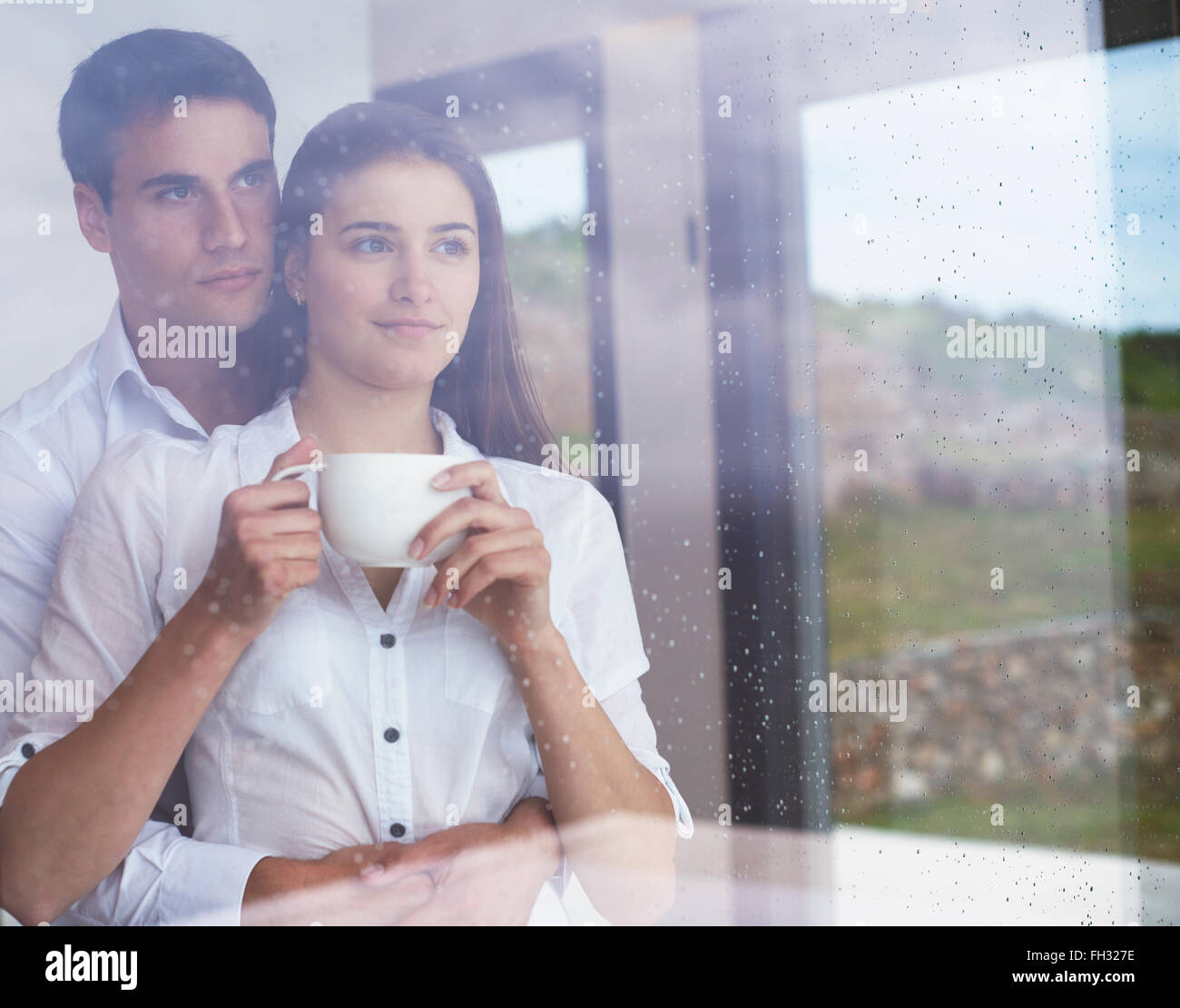 relaxet young couple drink first morning coffee Stock Photo - Alamy