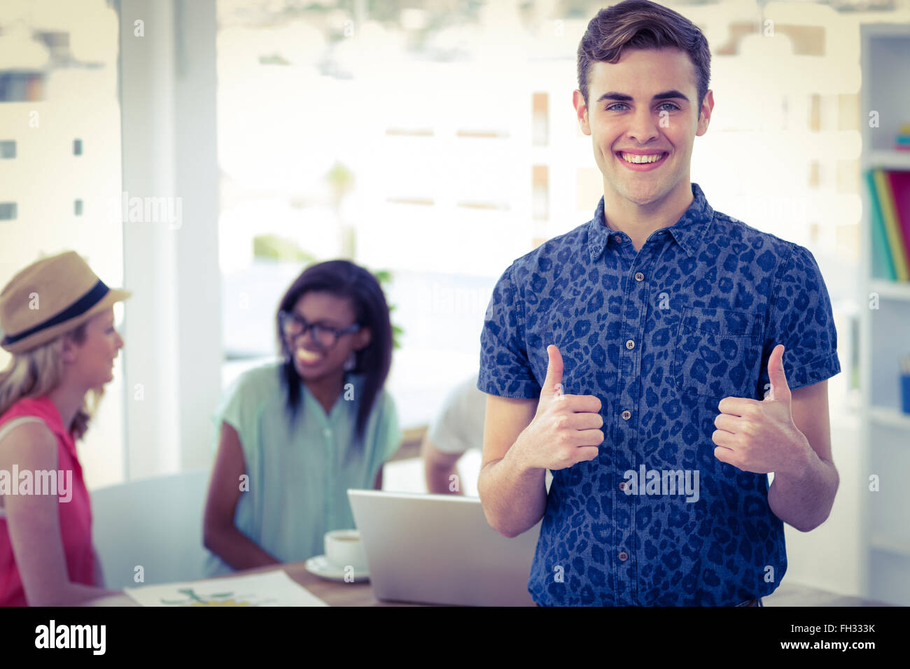 Smiling positive co workers hi-res stock photography and images - Alamy