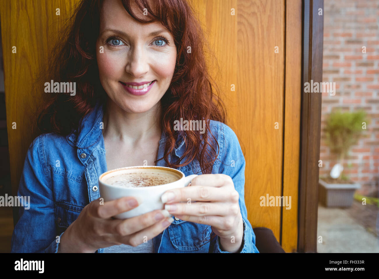 Mature student having coffee in cafe Stock Photo - Alamy