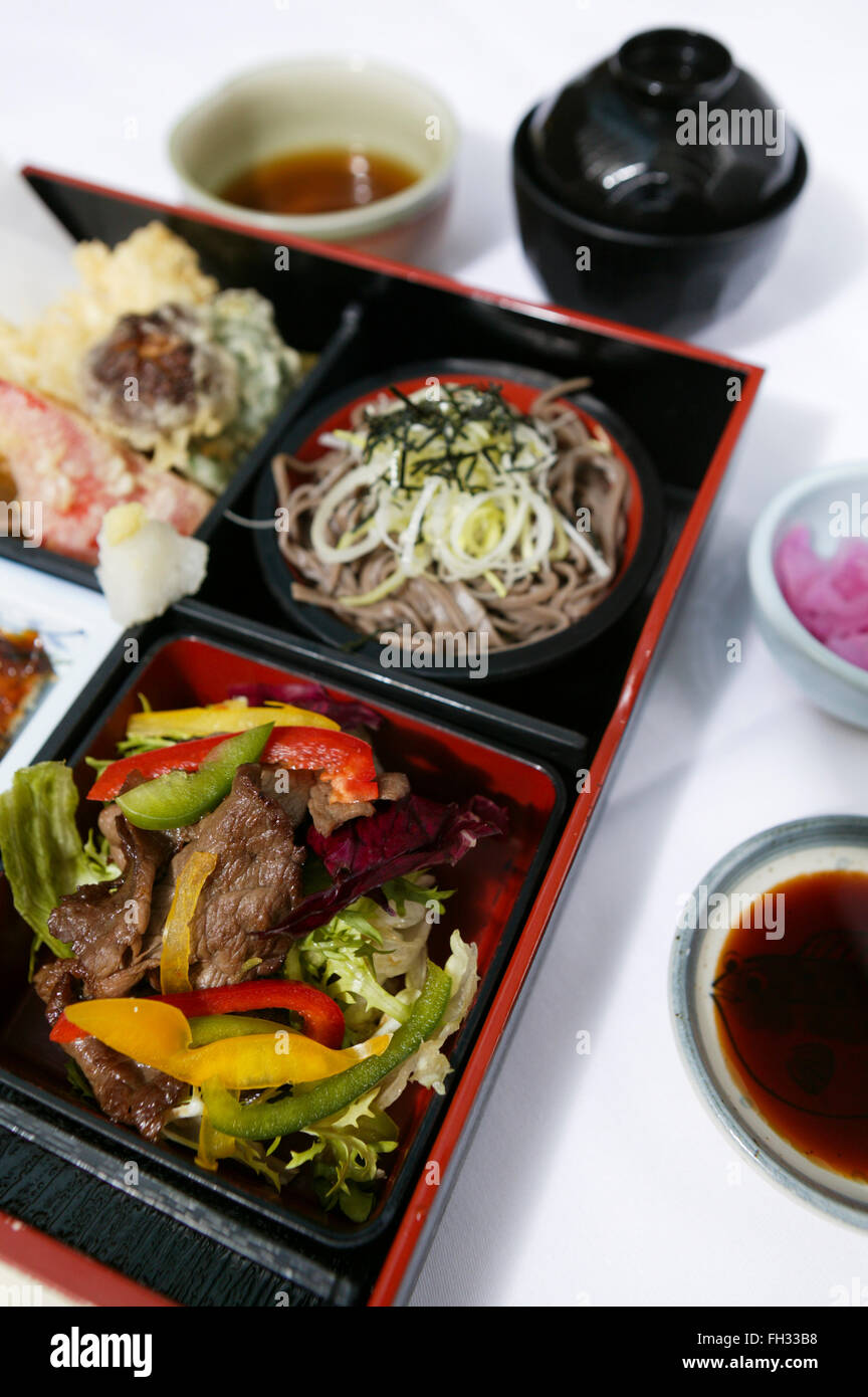Detail of a Japanese Bento Box, full of perfect japanese food including ...