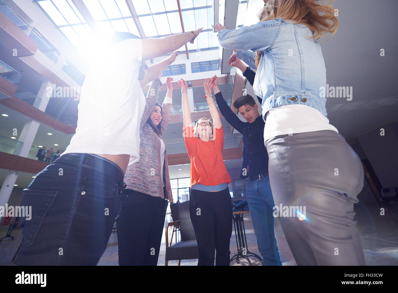 happy students celebrate Stock Photo - Alamy