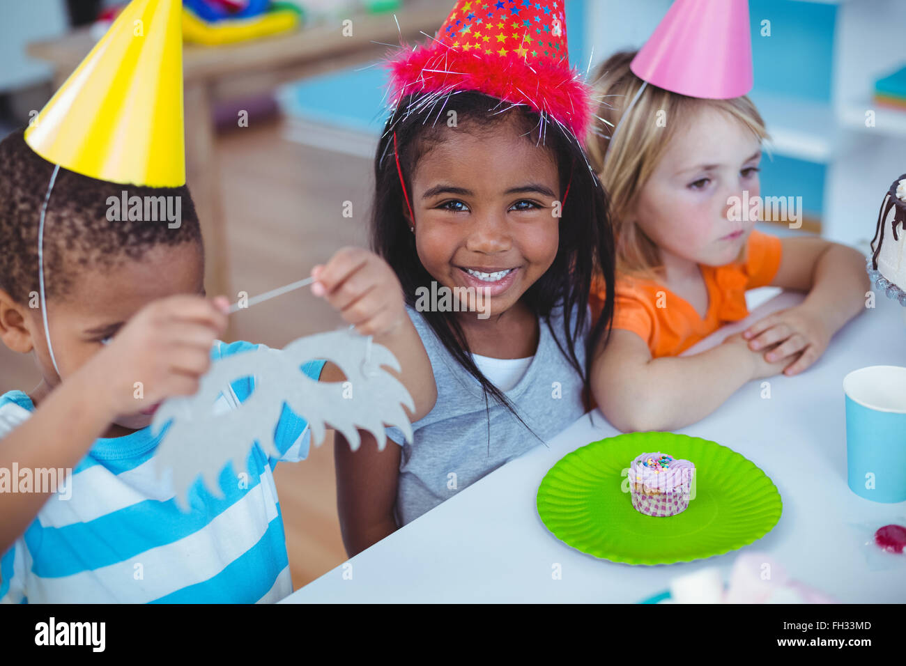 Excited kids enjoying a birthday party Stock Photo - Alamy