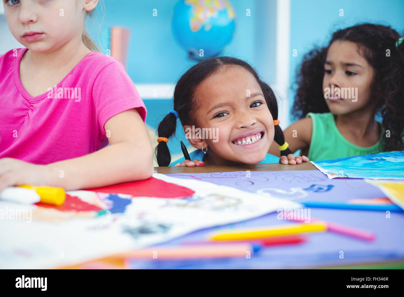 Happy kids all drawing pictures Stock Photo - Alamy