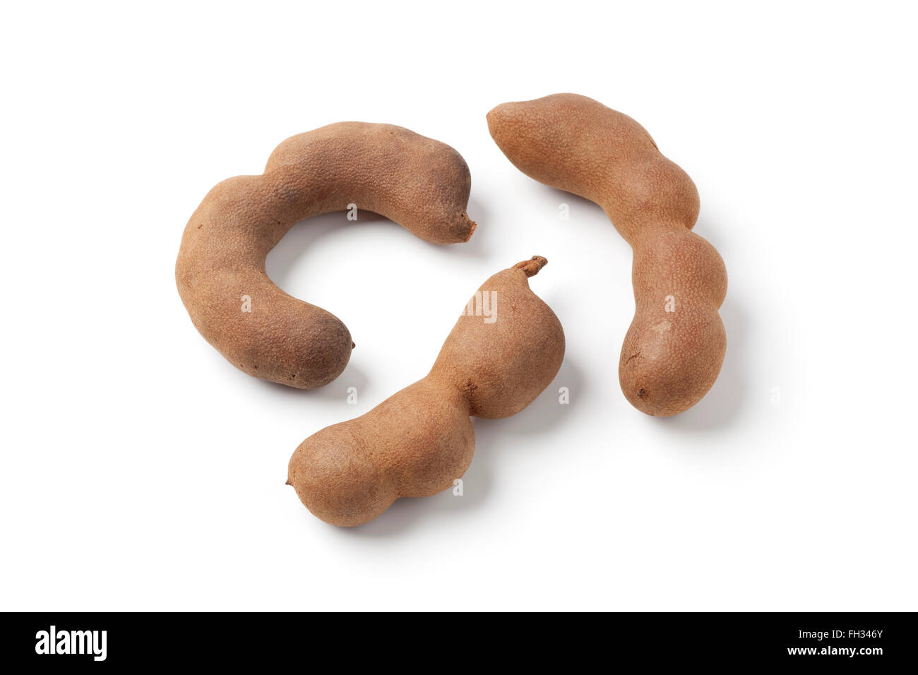 Whole sweet tamarind isolated on white background Stock Photo - Alamy