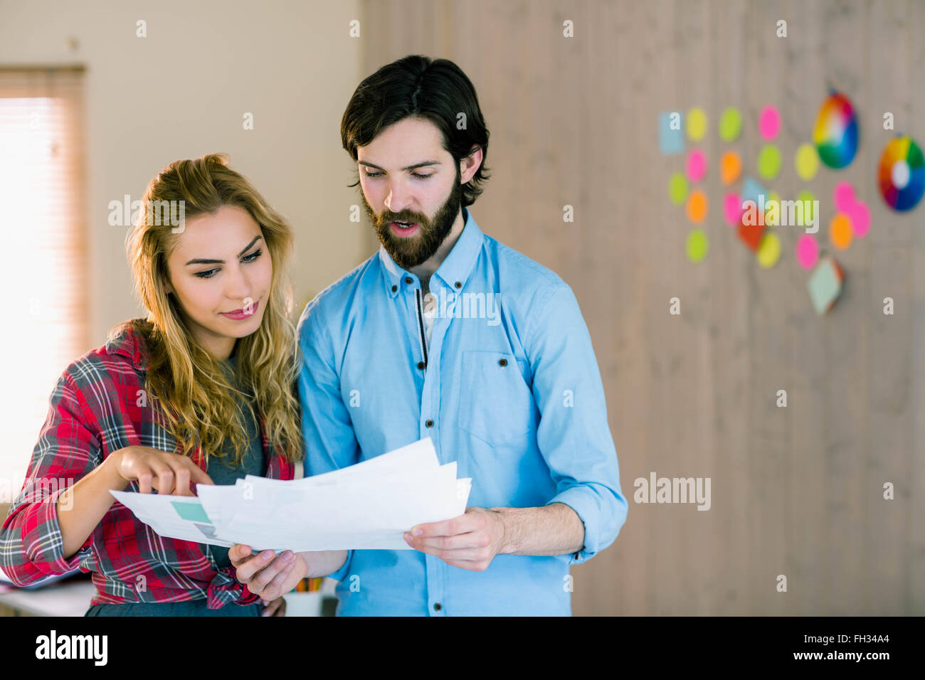 Creative team looking at their notes Stock Photo - Alamy