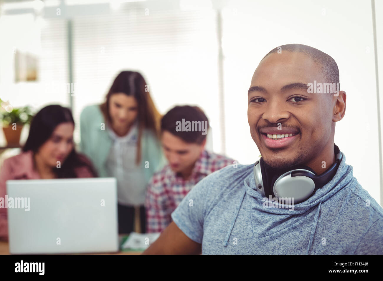 Young creative worker using tablet Stock Photo - Alamy