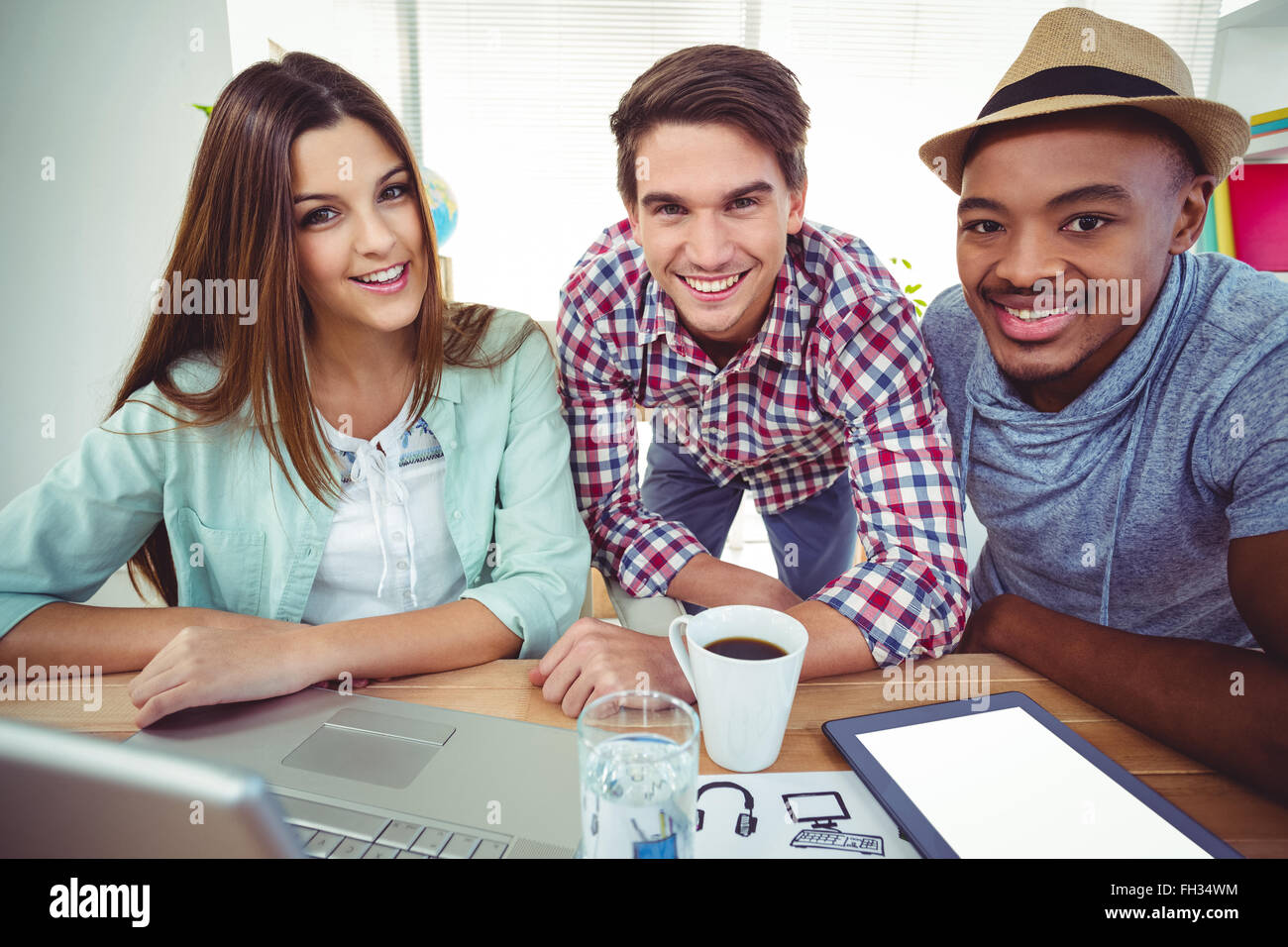 Young creative team working together Stock Photo - Alamy