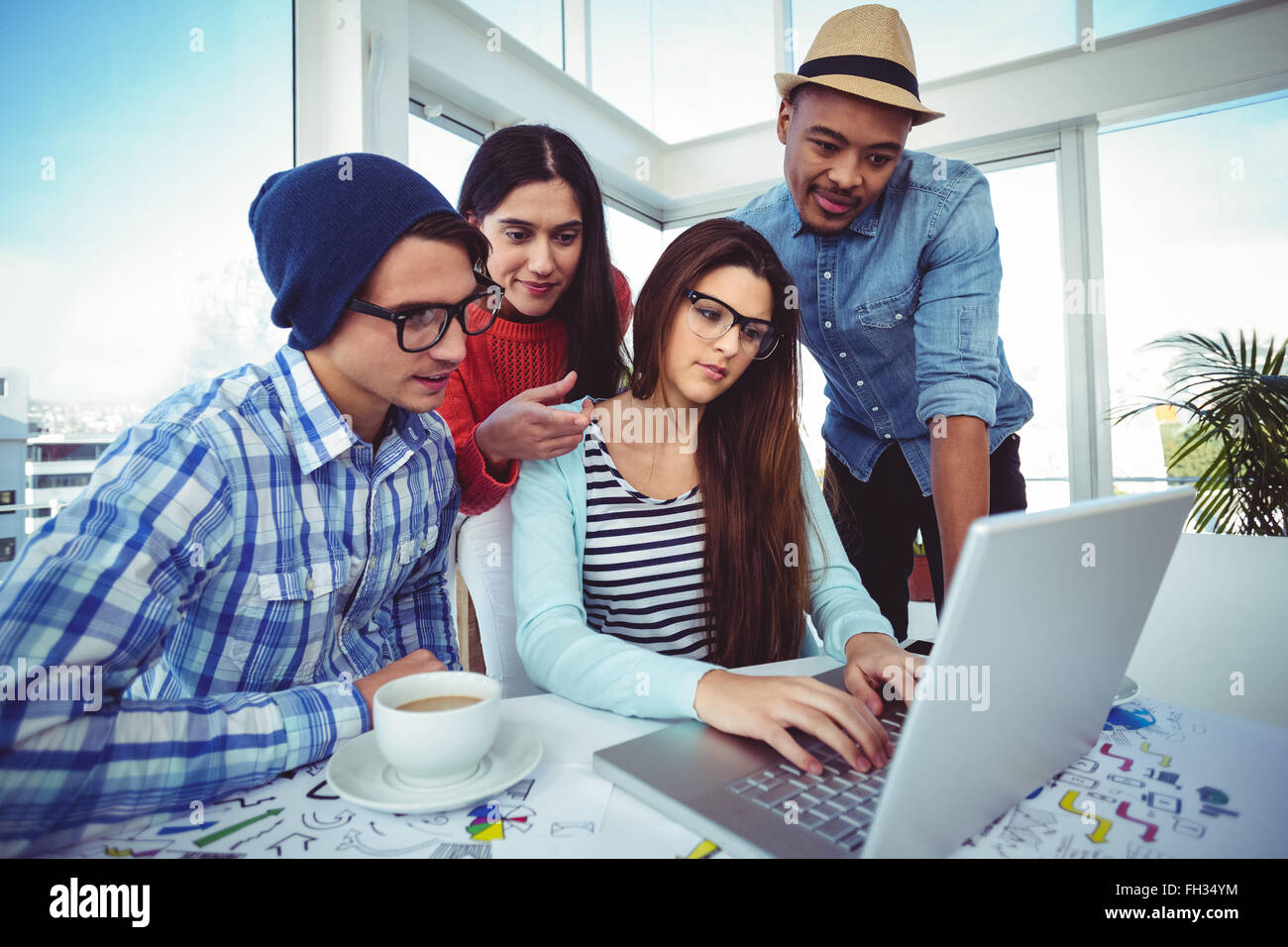 Young creative team having a meeting Stock Photo - Alamy