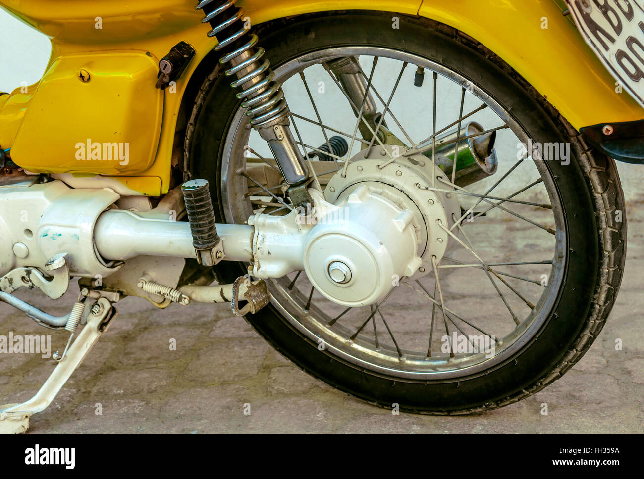 Yellow vintage motorcycle wheel Stock Photo - Alamy