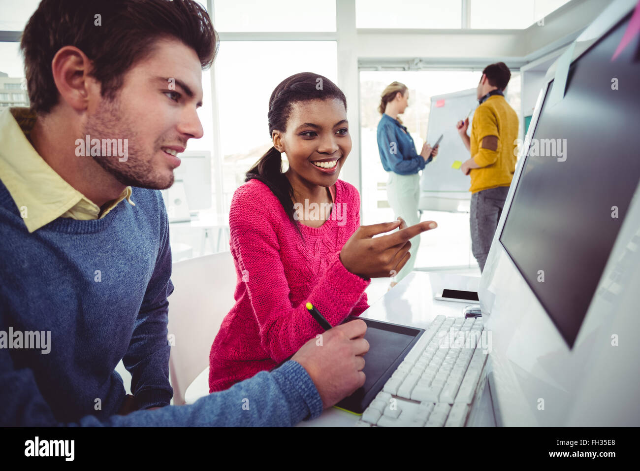 Creative business team working hard together Stock Photo - Alamy